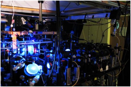 First Entanglement Between Light And Optical Atomic Coherence